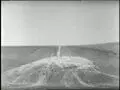 Earth explodes in clouds of dust during an underground atomic bomb test ...